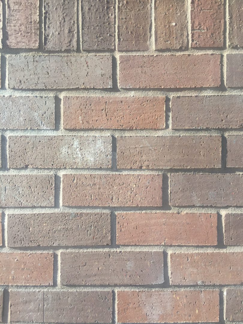 Pattern of bright bricks with alternating shades of red | Free Textures