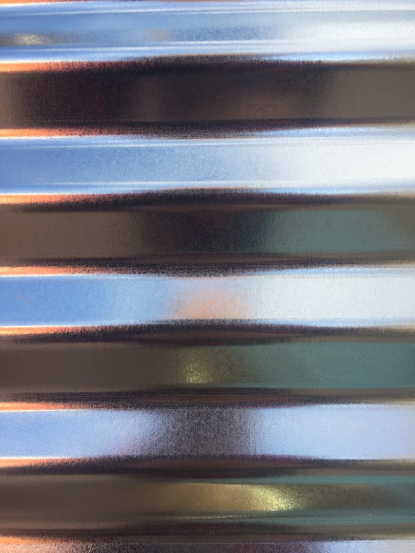 Clean metal close up with colorful reflection | Free Textures