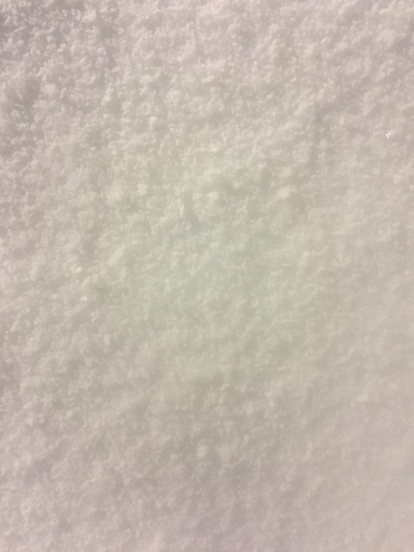 Close up of fluffy white snow patch with visible flakes | Free Textures