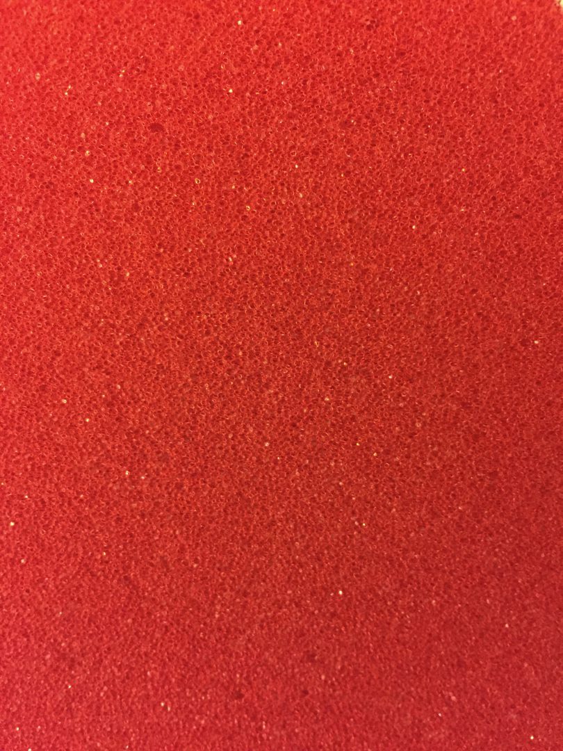 Close up of red plastic with pattern of cells | Free Textures