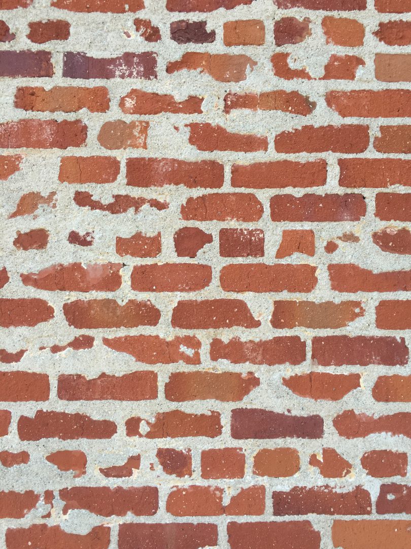 Brick wall with messy mortar covering portions of each brick | Free ...