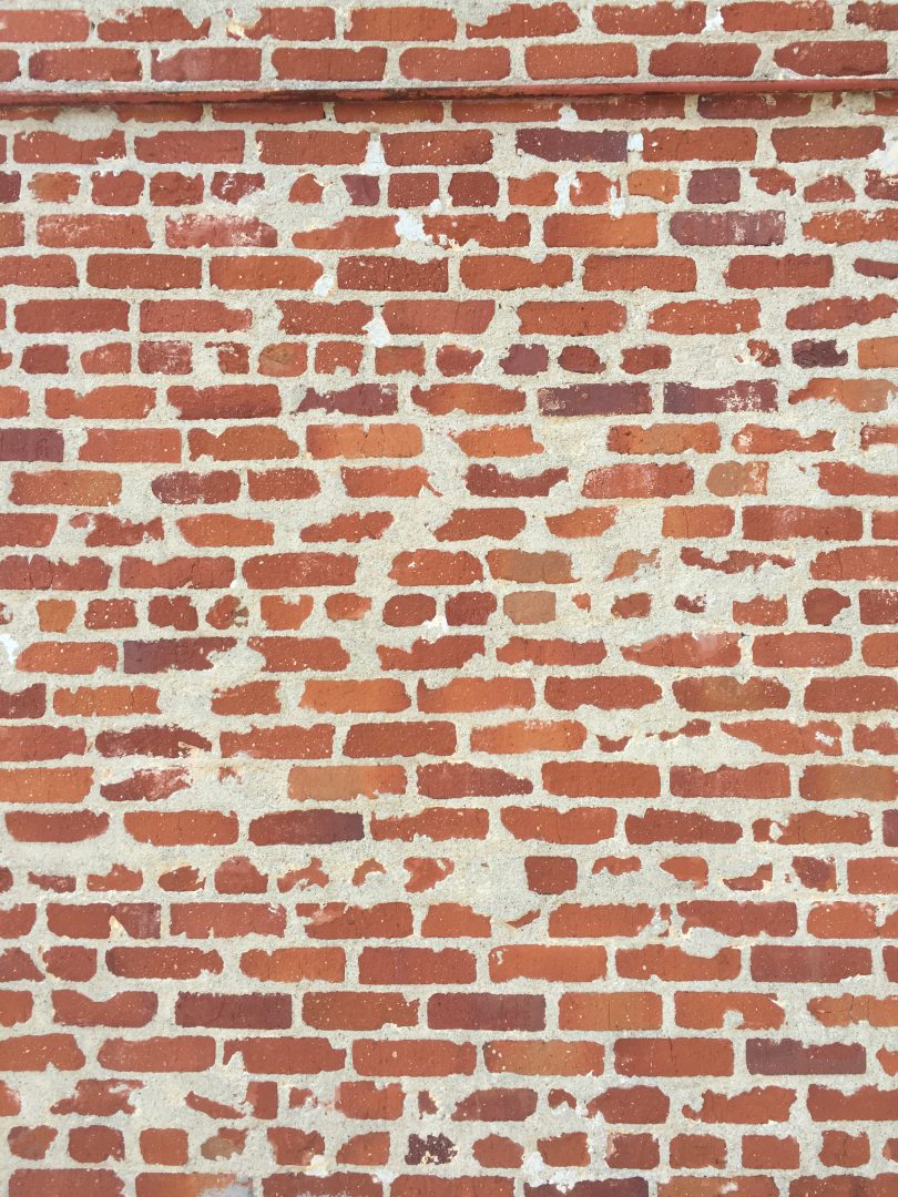 Flat brick wall with sloppy grout | Free Textures