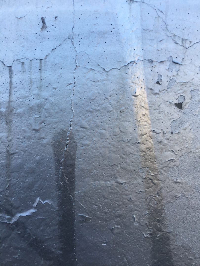 Grungy wall covered in black paint and spray paint | Free Textures